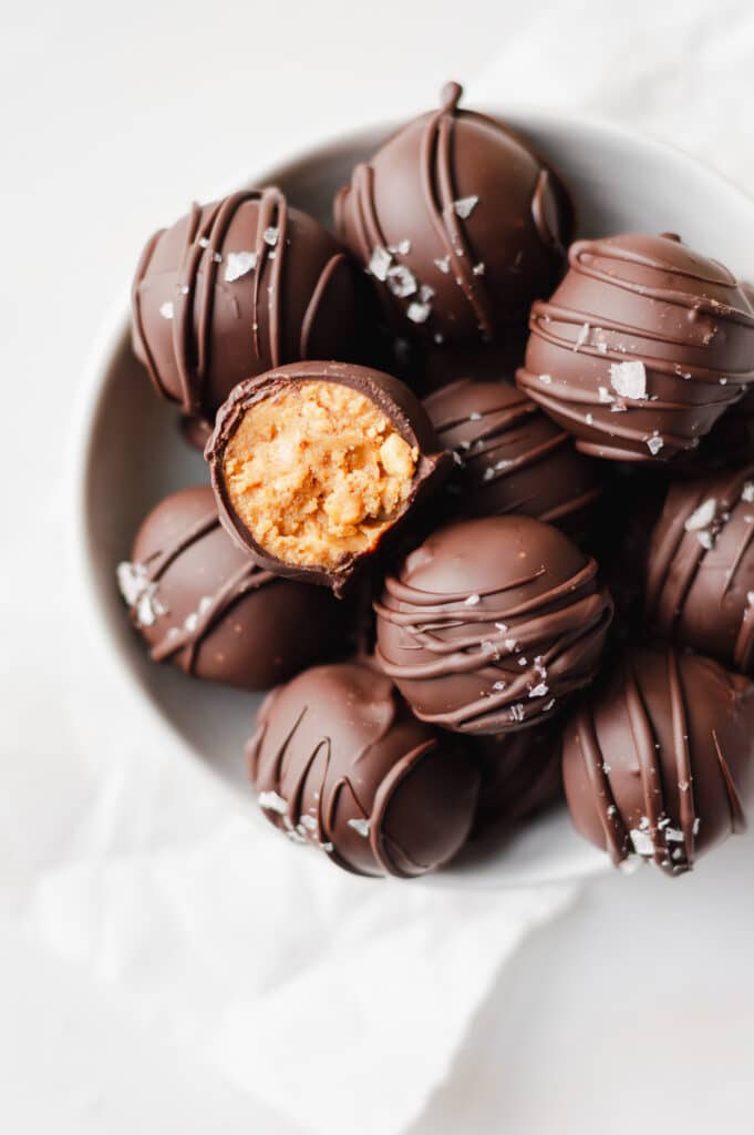 Easy Chocolate Covered Peanut Butter Protein Balls - Notably Vegan
